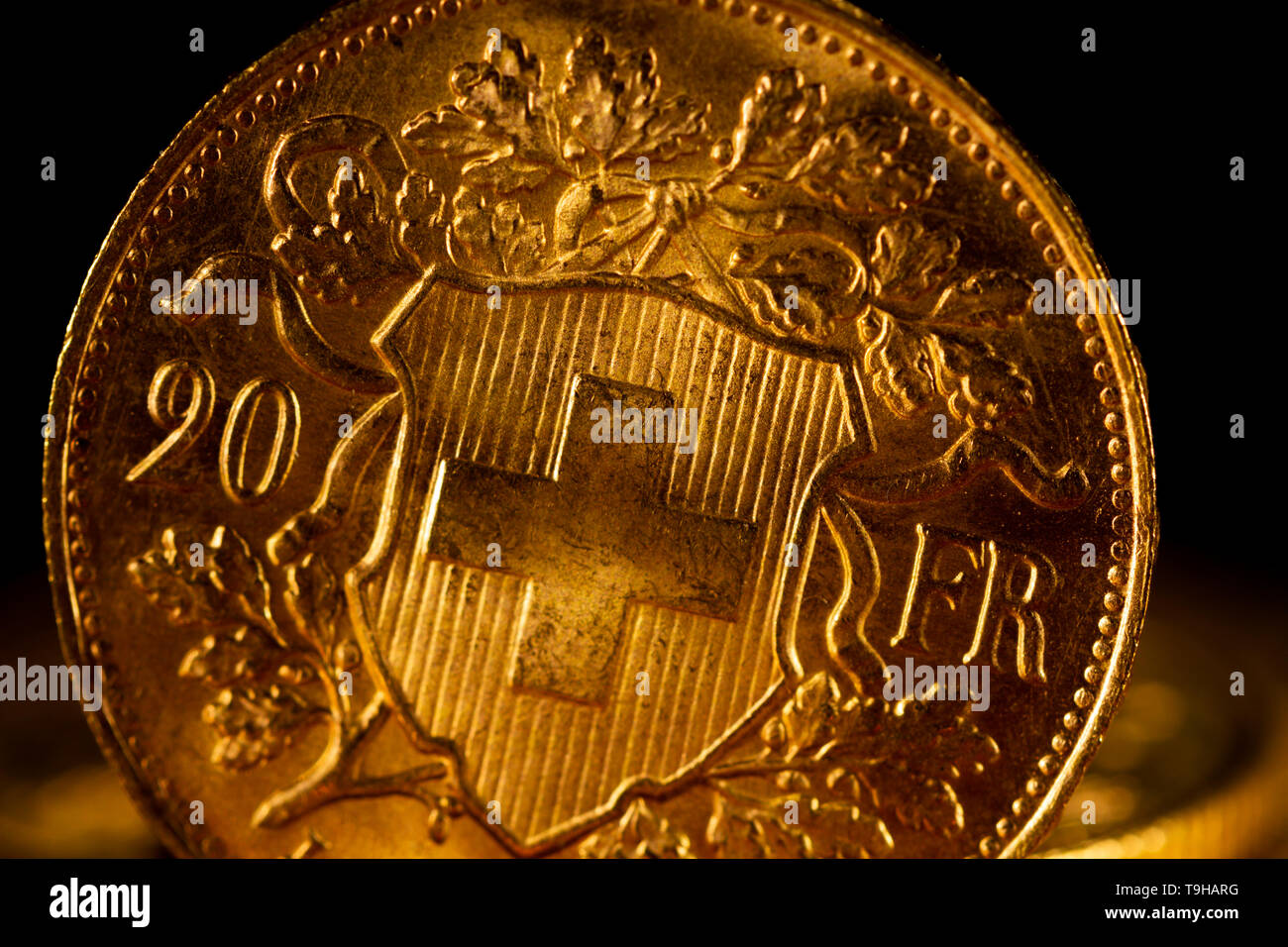 Real Gold coins over dark background Stock Photo - Alamy