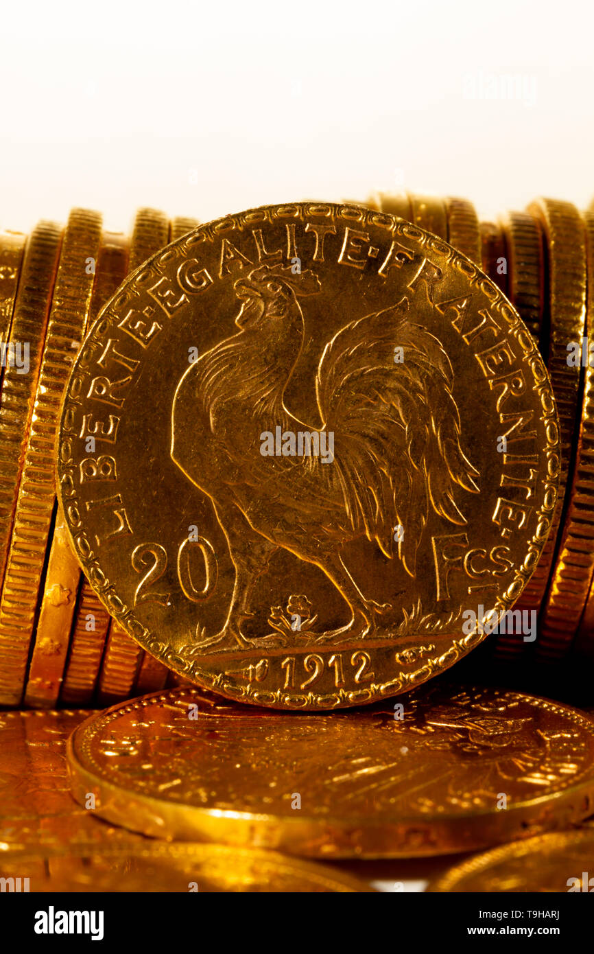 Real Gold coins over dark background Stock Photo - Alamy