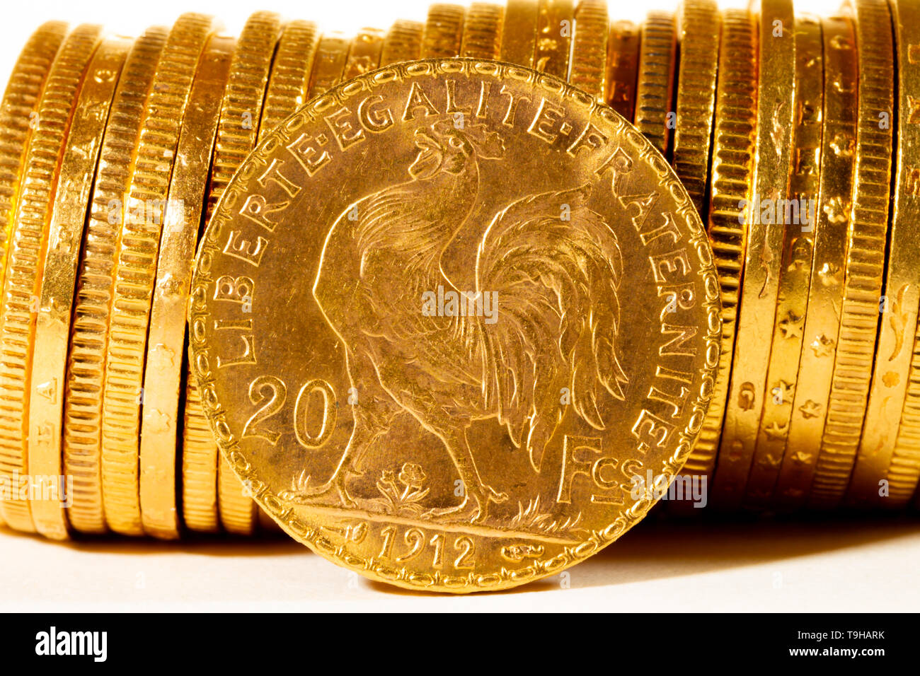 Real Gold coins over dark background Stock Photo - Alamy