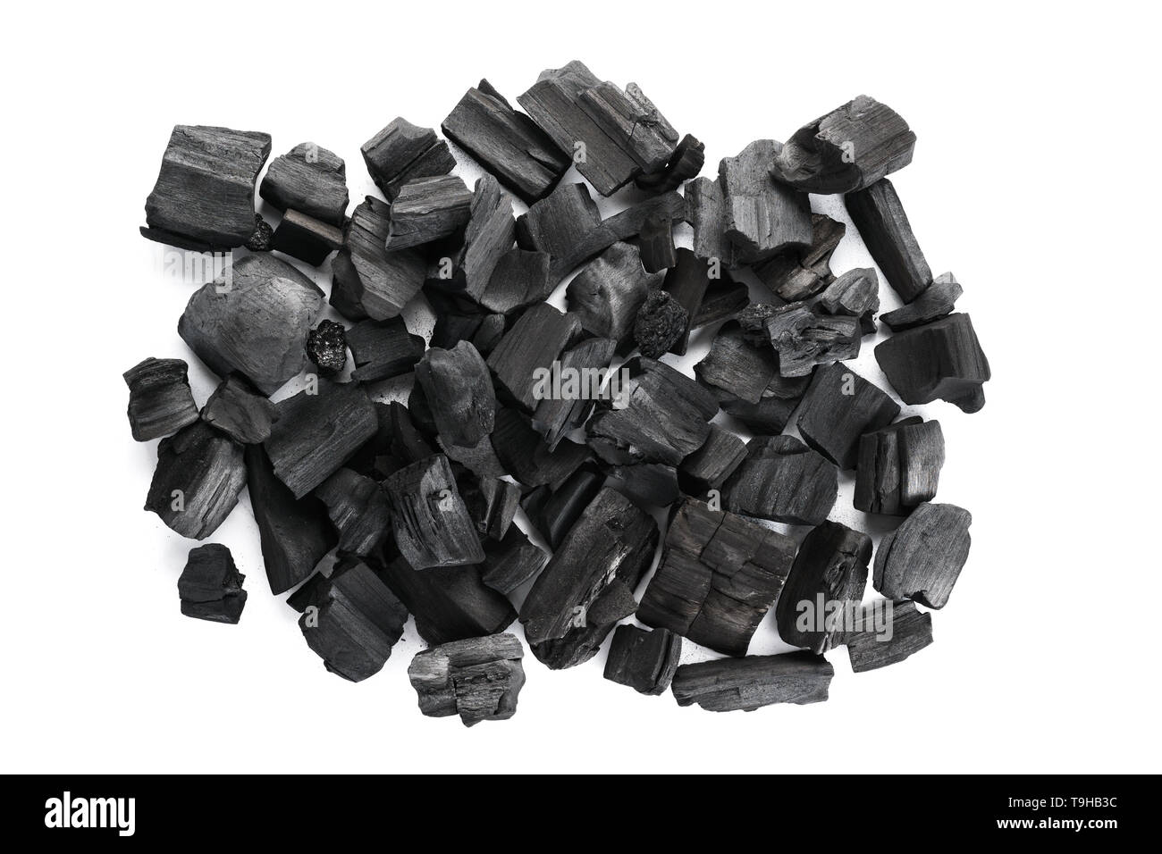 Natural hardwood charcoal isolated on white background. Top view Stock ...