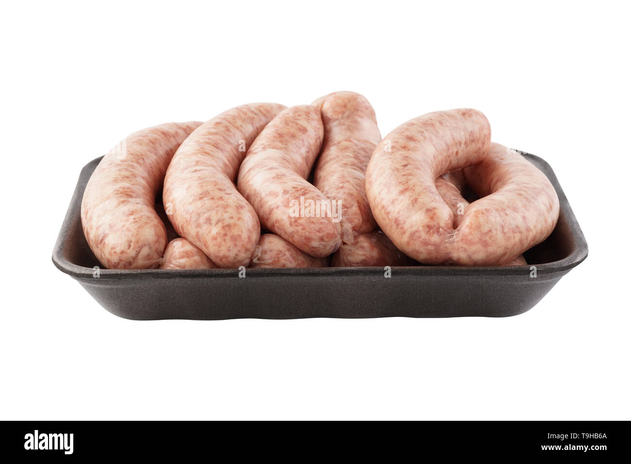 Raw sausages on black foam tray. Isolated on white. Side view Stock ...