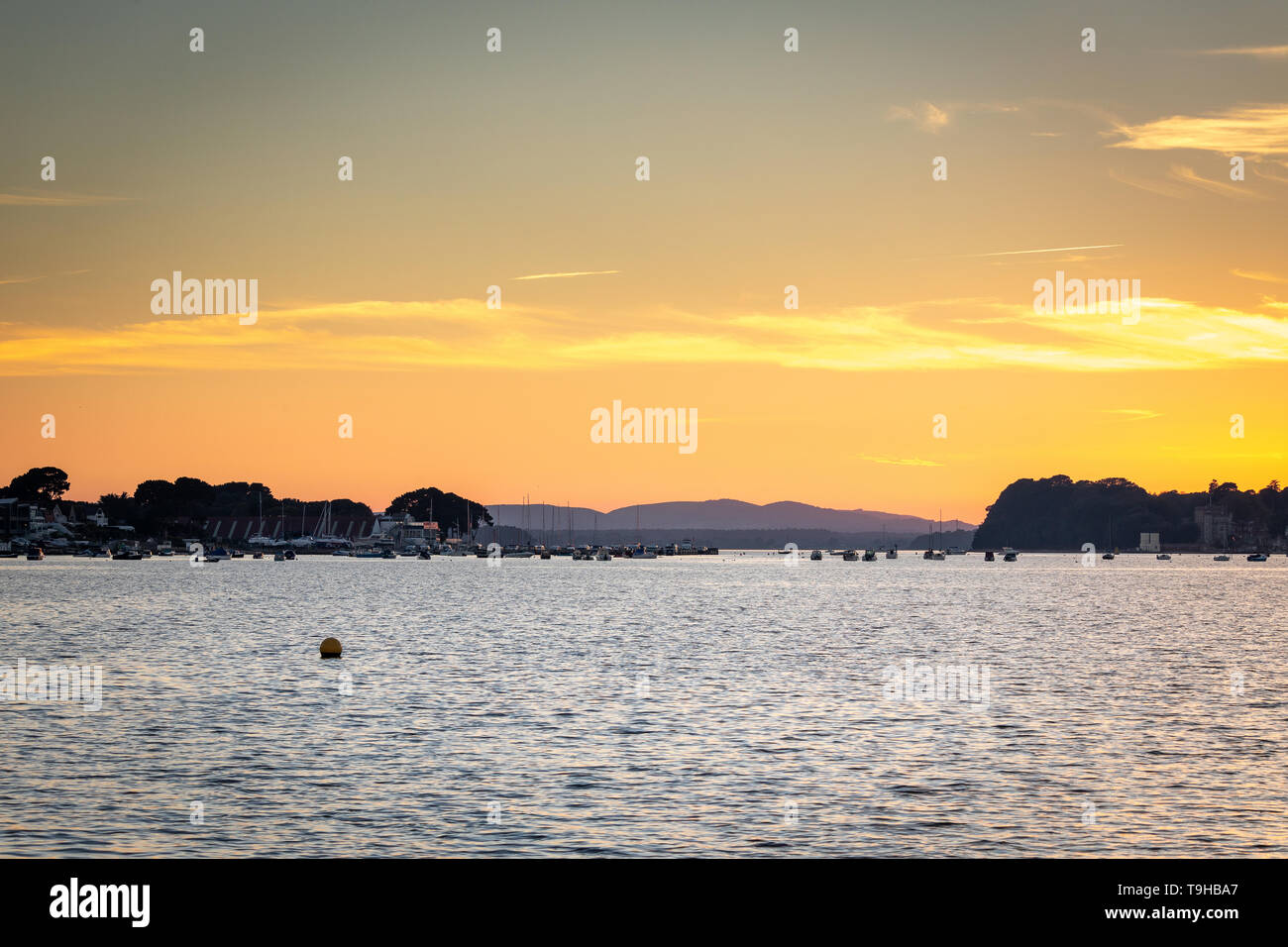 Sun setting over harbour hi-res stock photography and images - Alamy