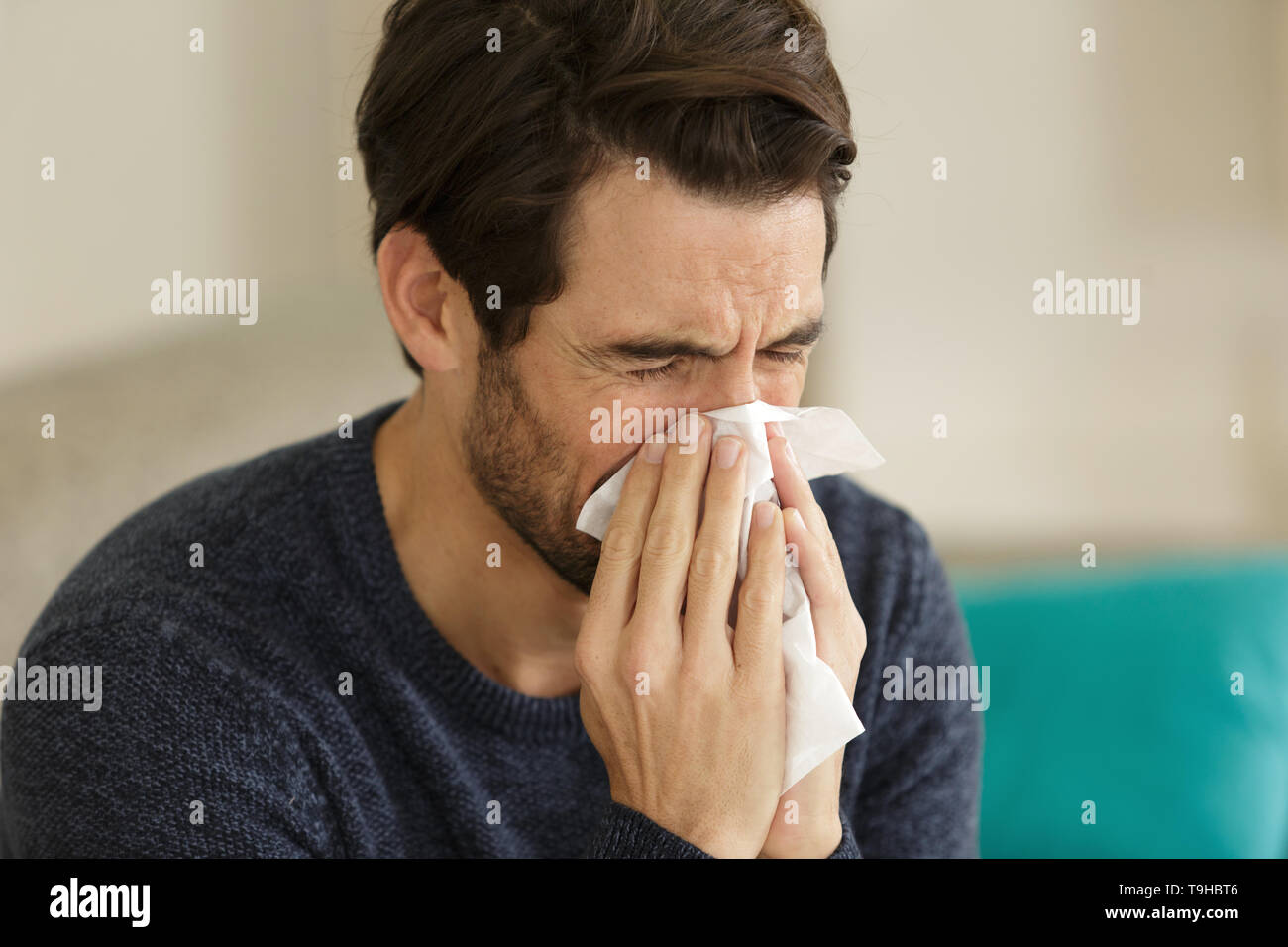 man blowing his nose Stock Photo - Alamy