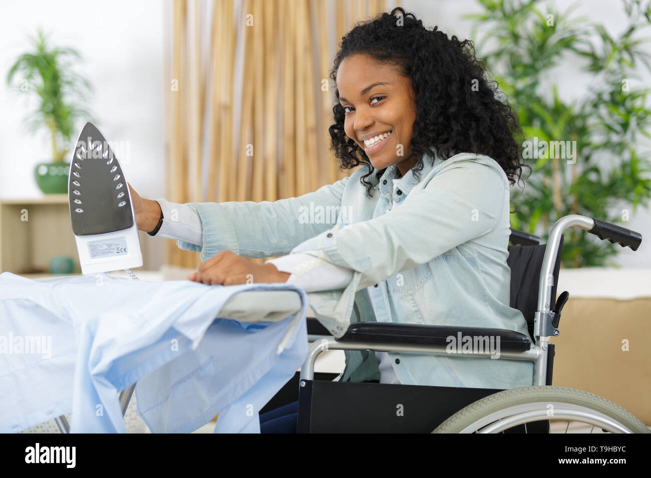 happy handicaped person must do her housekeeping herself Stock Photo ...
