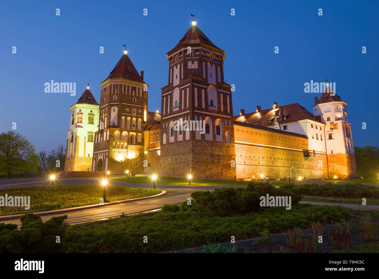 Mir Castle in the night illumination on April evening. Mir, Belarus ...