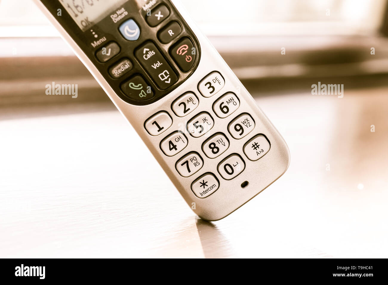 Traditional landline phone isolated on wooden desk background Stock ...