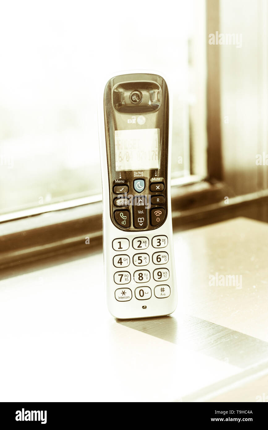 Traditional landline phone isolated on wooden desk background Stock ...