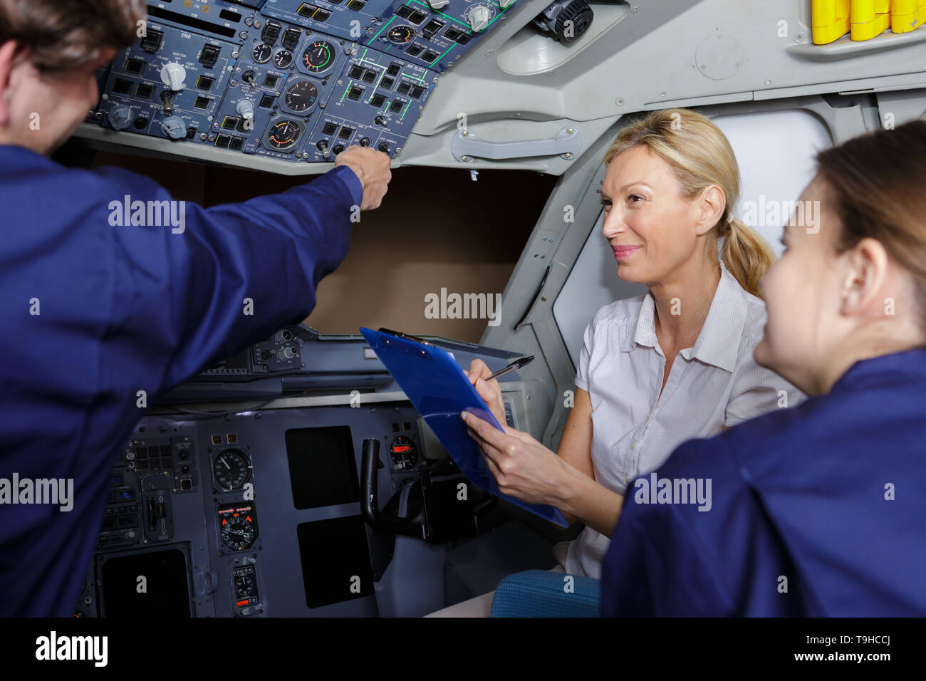 technicians in an airplane cockpit Stock Photo - Alamy