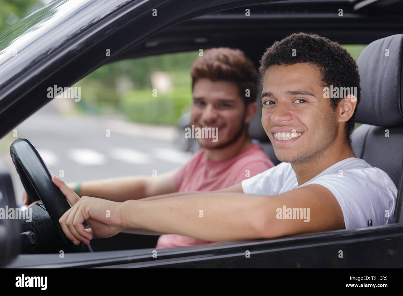 happy young man driving a car Stock Photo - Alamy