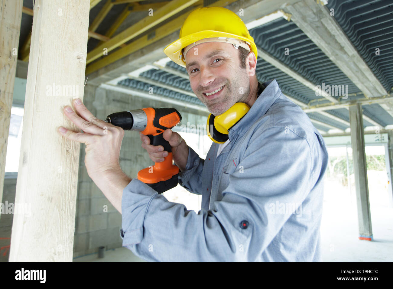 happy man working as handyman Stock Photo - Alamy
