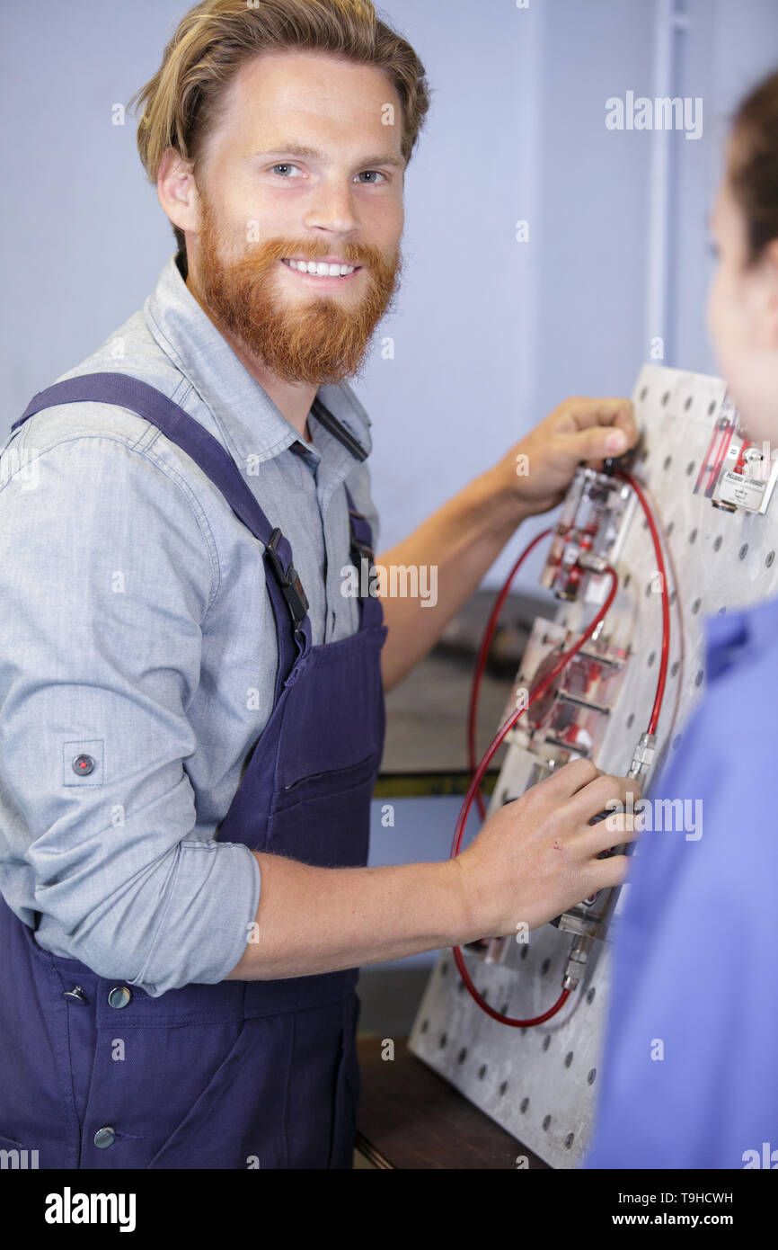 man and woman engineer working with electrical cables Stock Photo - Alamy