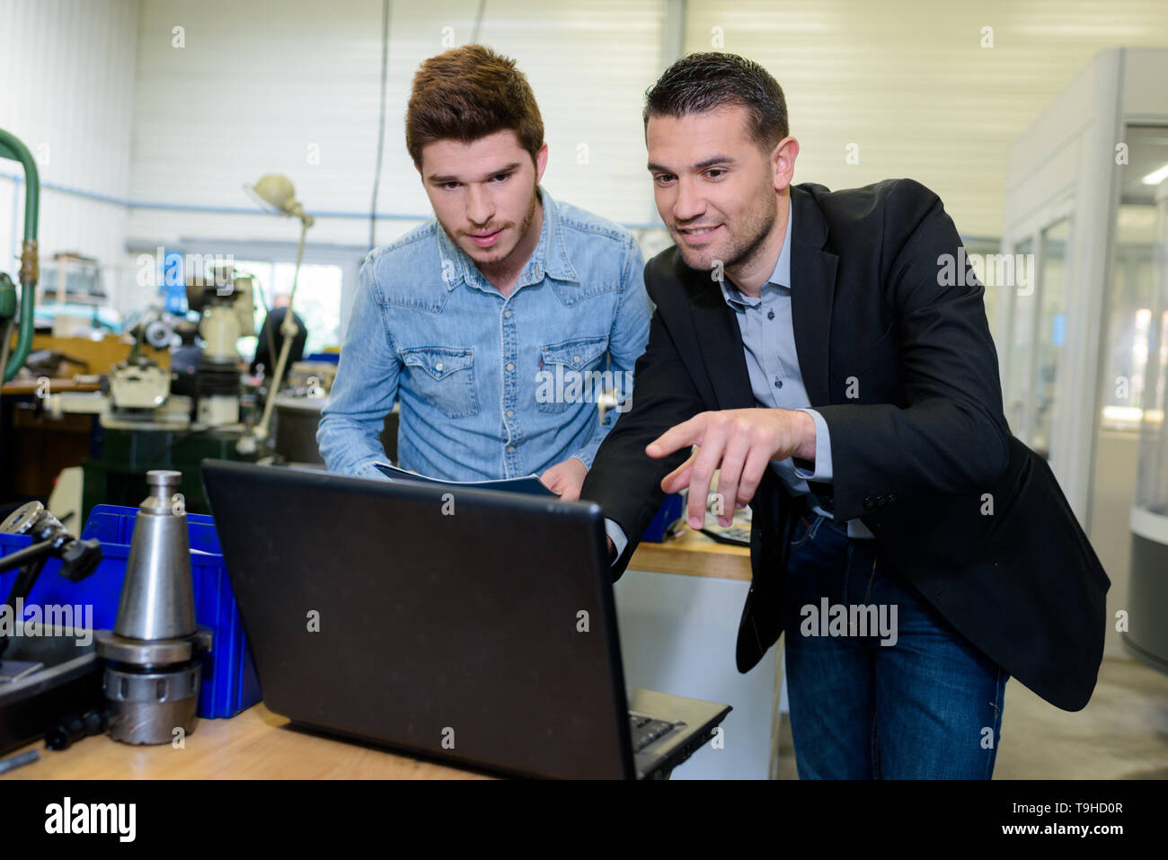 professional male engineer with boss Stock Photo - Alamy