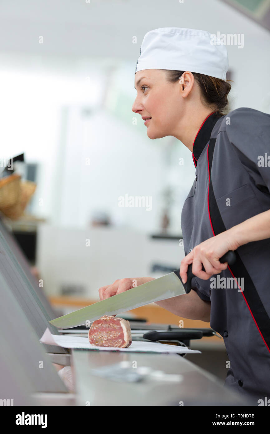 woman cuts meat Stock Photo - Alamy