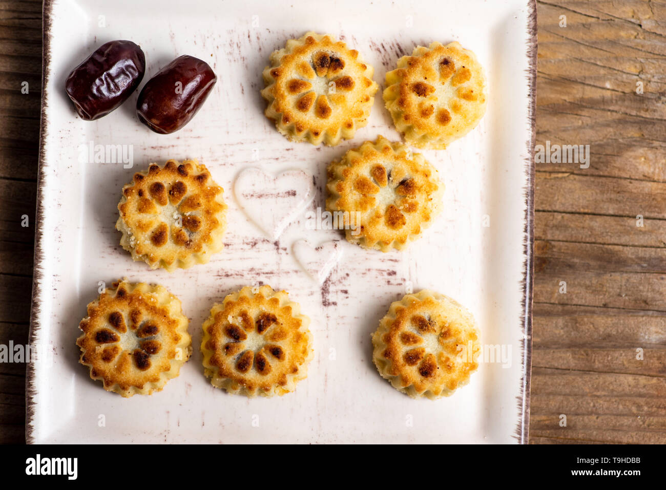 Arabic cookies with dates on a plate Stock Photo - Alamy