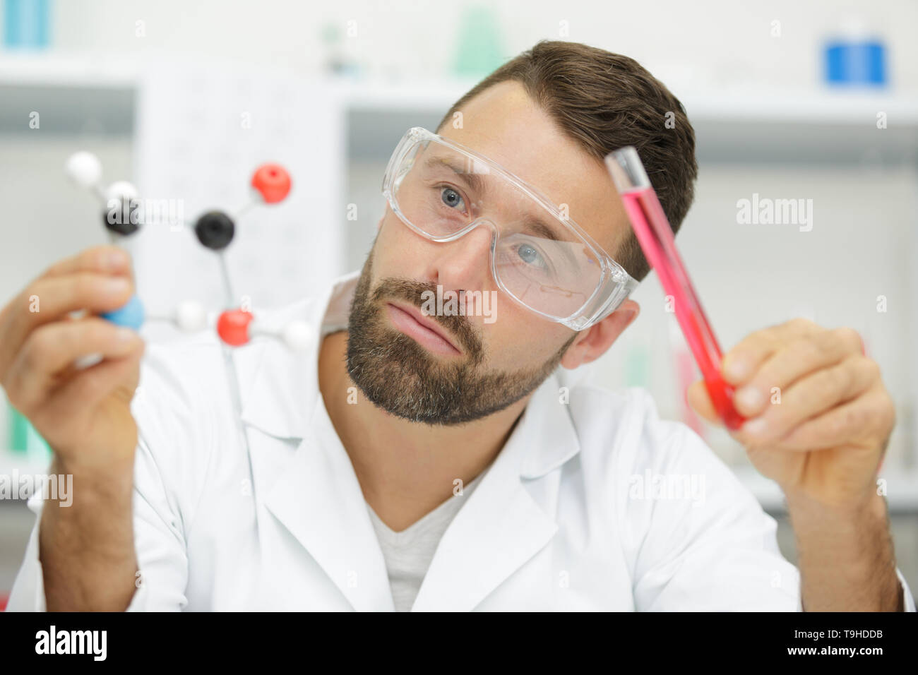 scientist checking filled test tubes with pipette in lab Stock Photo ...
