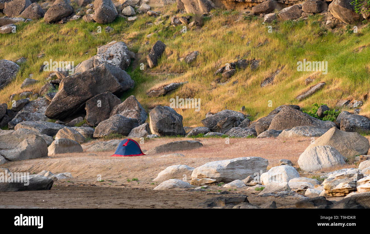 Tourist tent among the rocks Stock Photo - Alamy
