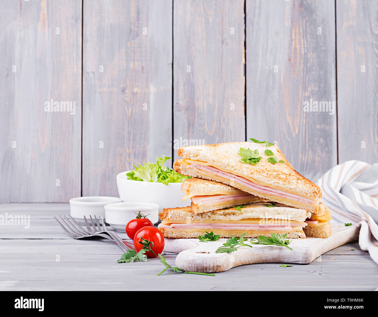 Club sandwich panini with ham, cheese and salad. Tasty breakfast Stock ...