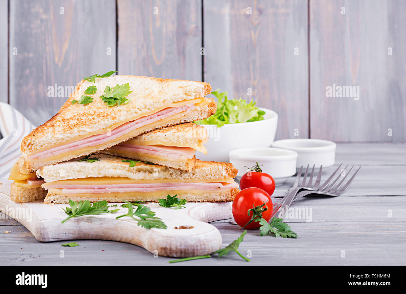 Club sandwich panini with ham, cheese and salad. Tasty breakfast Stock ...
