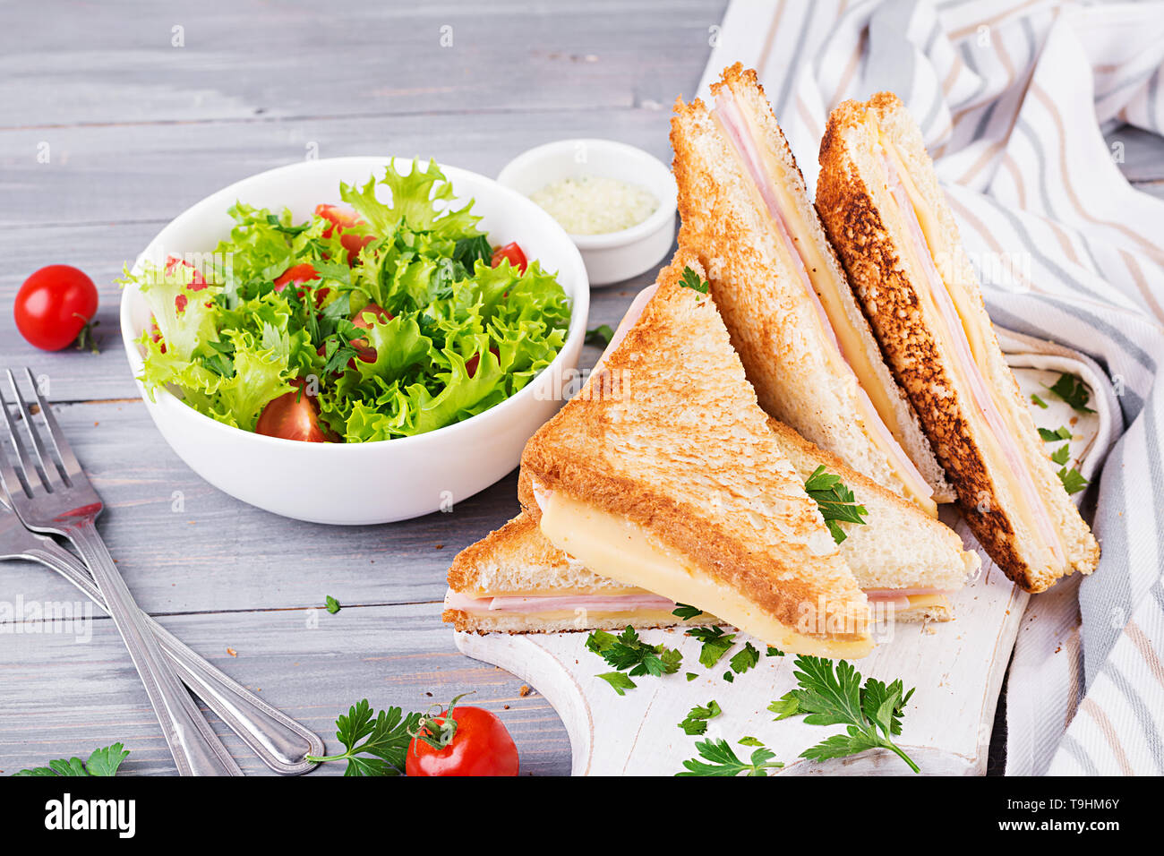 Club sandwich panini with ham, cheese and salad. Tasty breakfast Stock ...