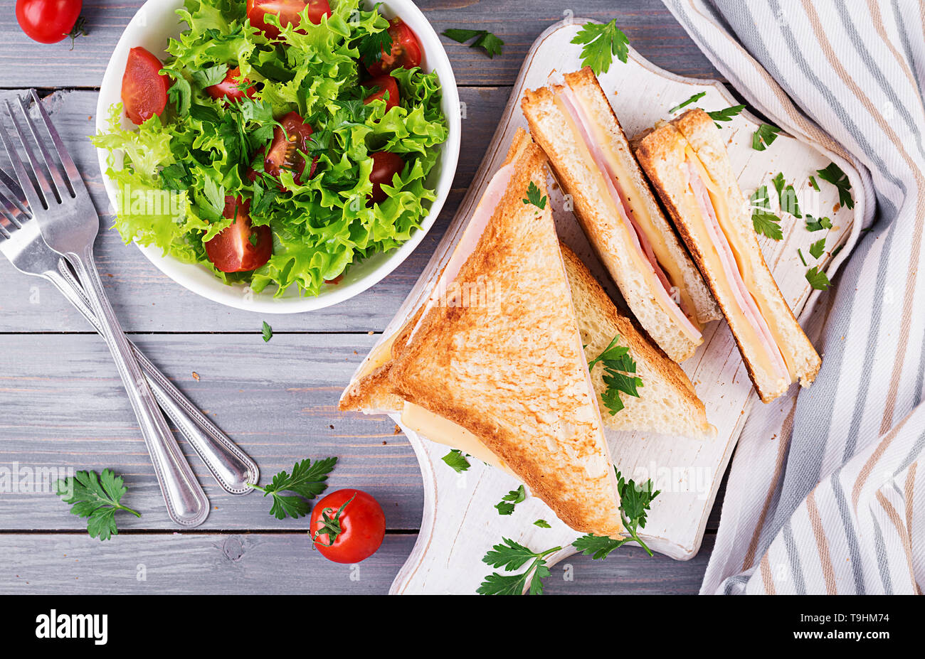 Club sandwich panini with ham, cheese and salad. Top view. Tasty ...