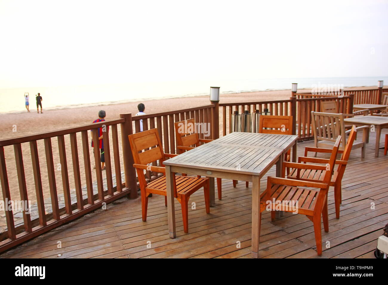 wood terrace with wooden table and desk on beach at sea view point.the ...