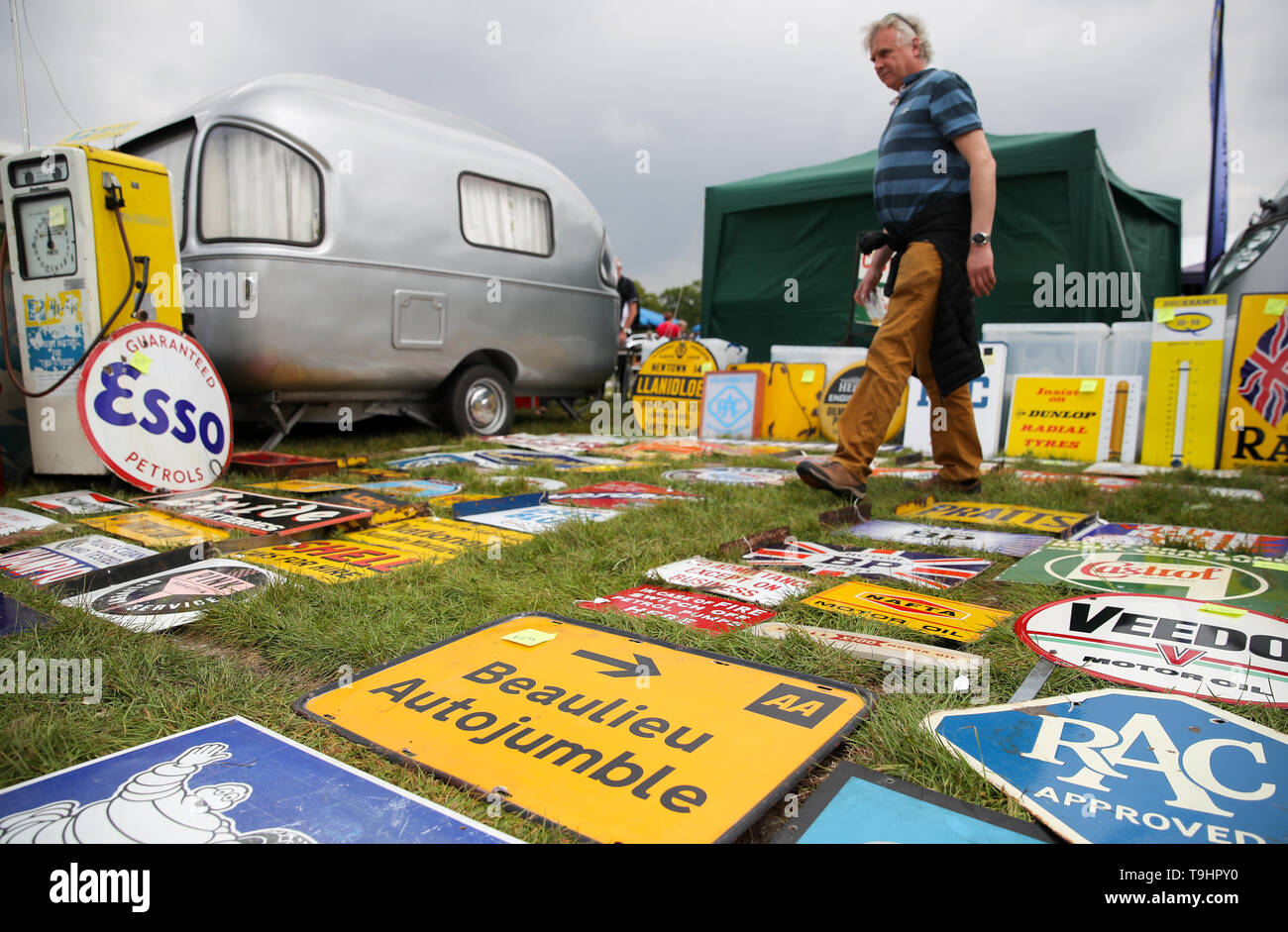 A person looks at road signs for sale at the Spring Autojumble at the ...