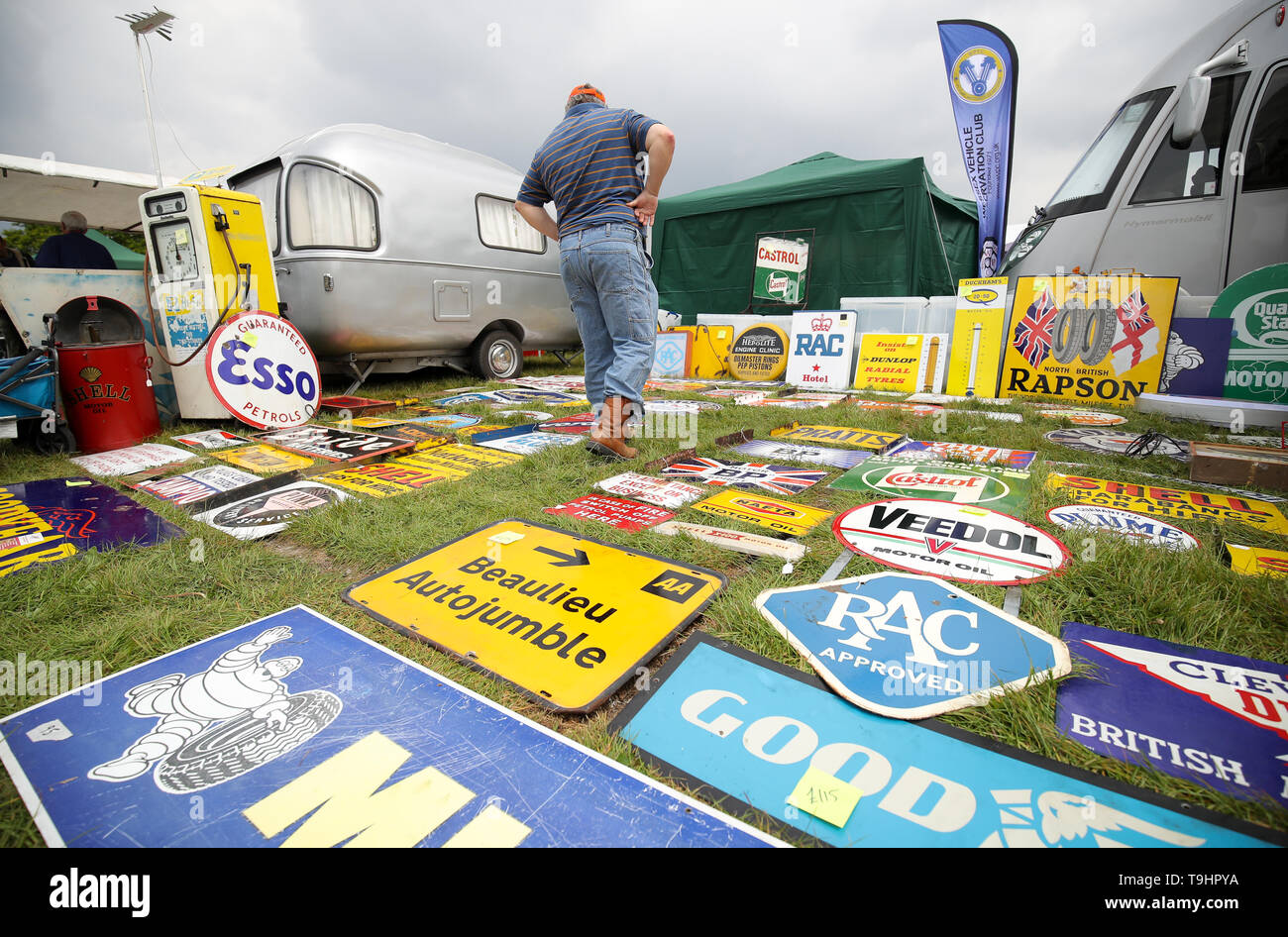 A person looks at road signs for sale at the Spring Autojumble at the ...