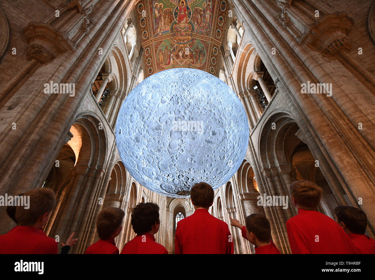 Choristers view Luke Jerram's 'Museum of the Moon' installation at Ely ...