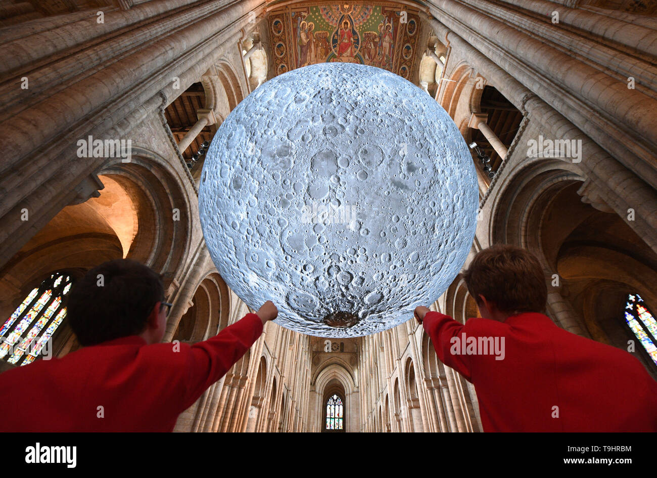 Choristers view Luke Jerram's 'Museum of the Moon' installation at Ely ...