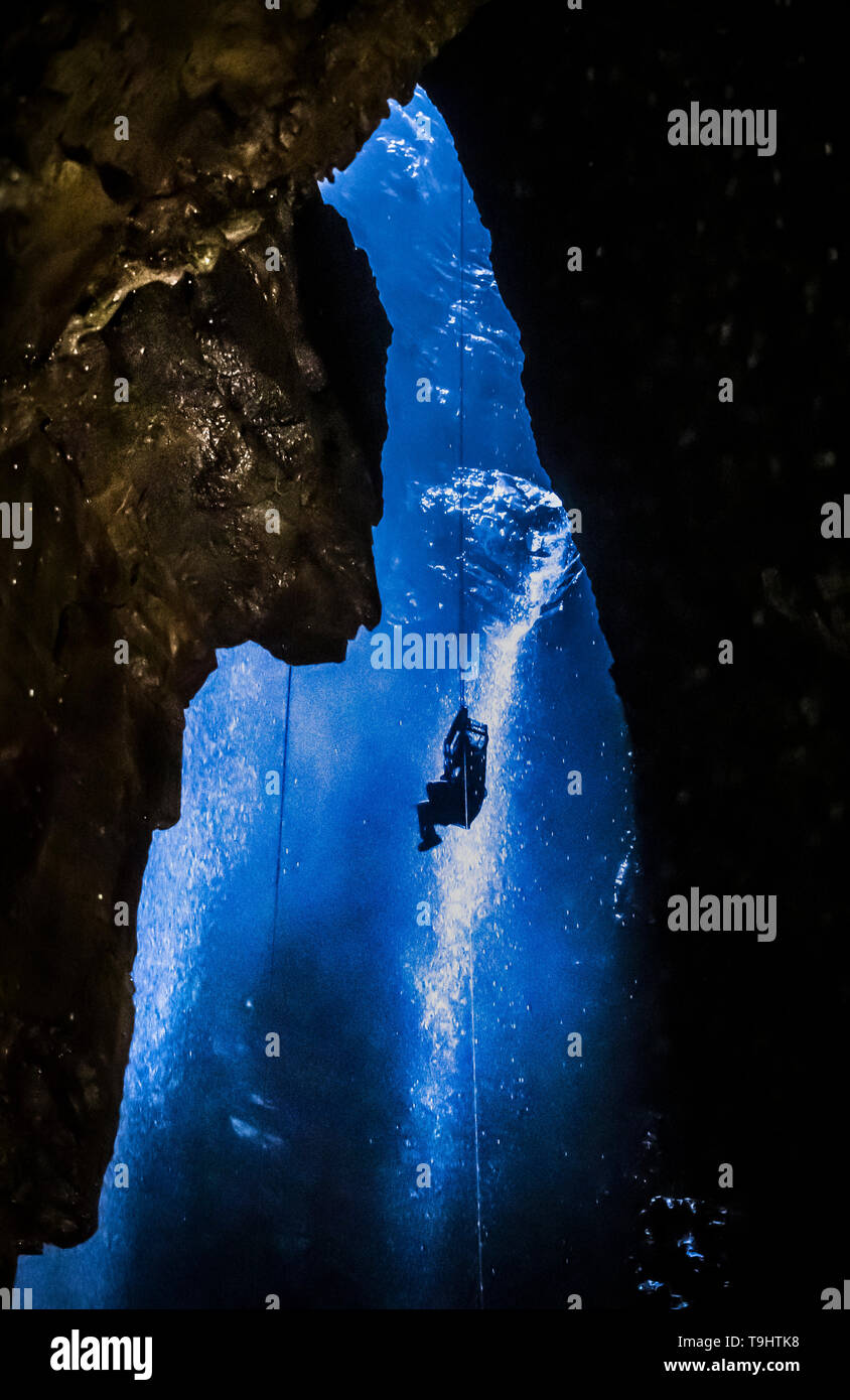 A potholer is winched into Gaping Gill, the largest cavern in Britain ...