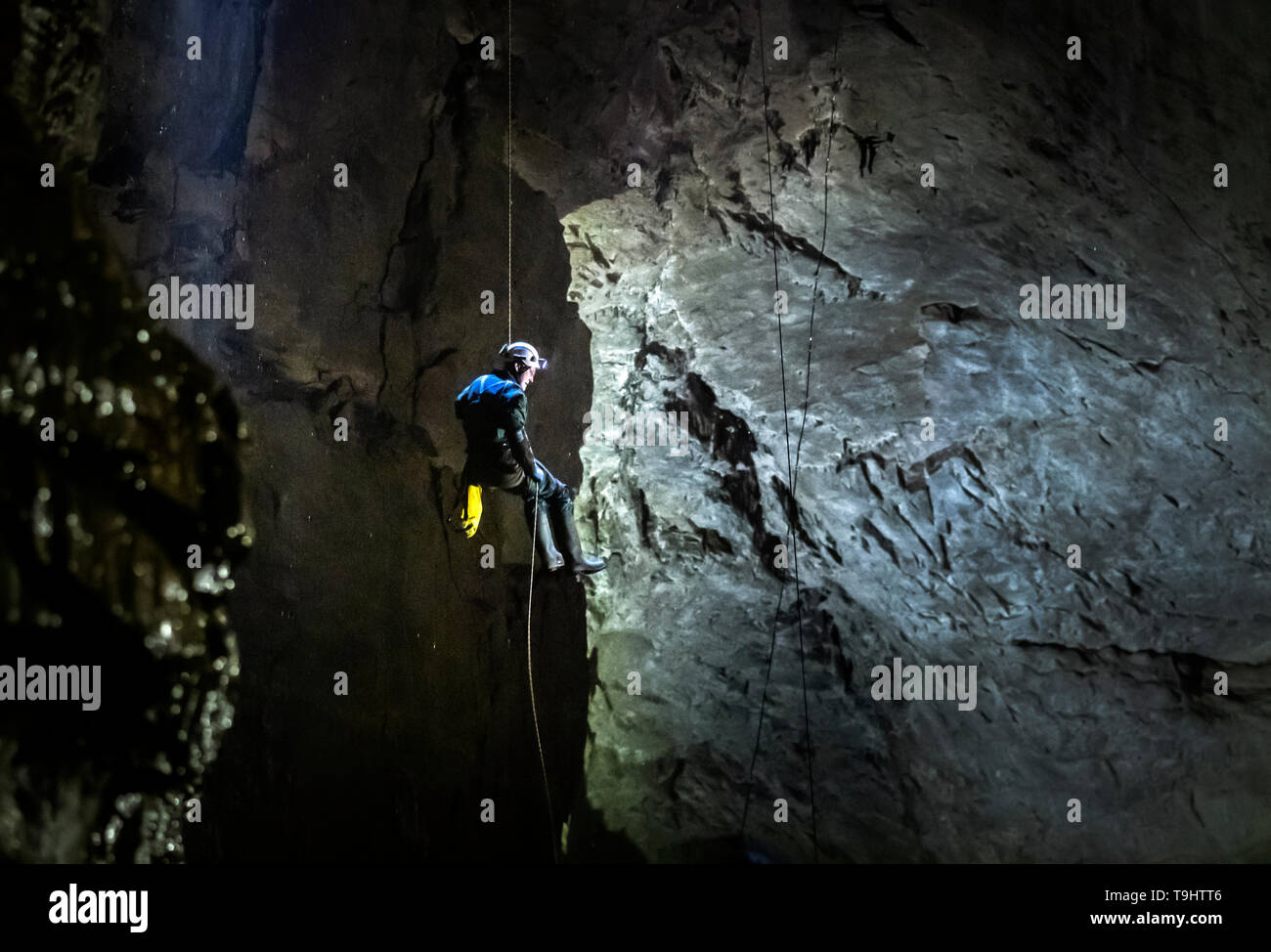 A potholer abseils into Gaping Gill, the largest cavern in Britain ...