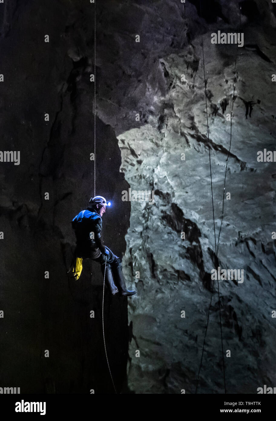 A potholer abseils into Gaping Gill, the largest cavern in Britain ...