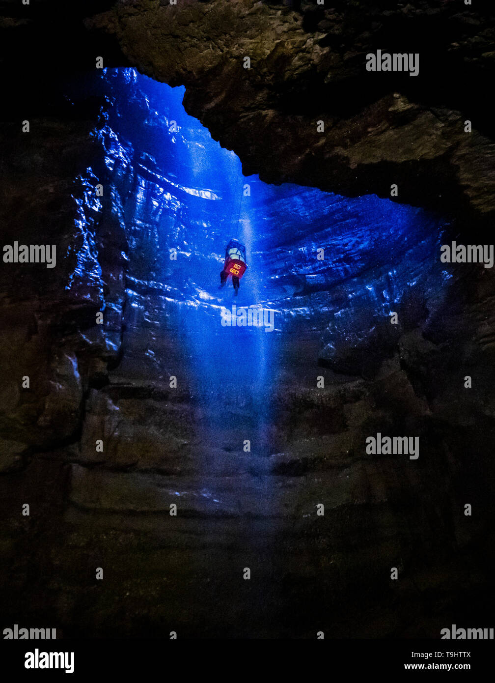 A potholer is winched into Gaping Gill, the largest cavern in Britain ...
