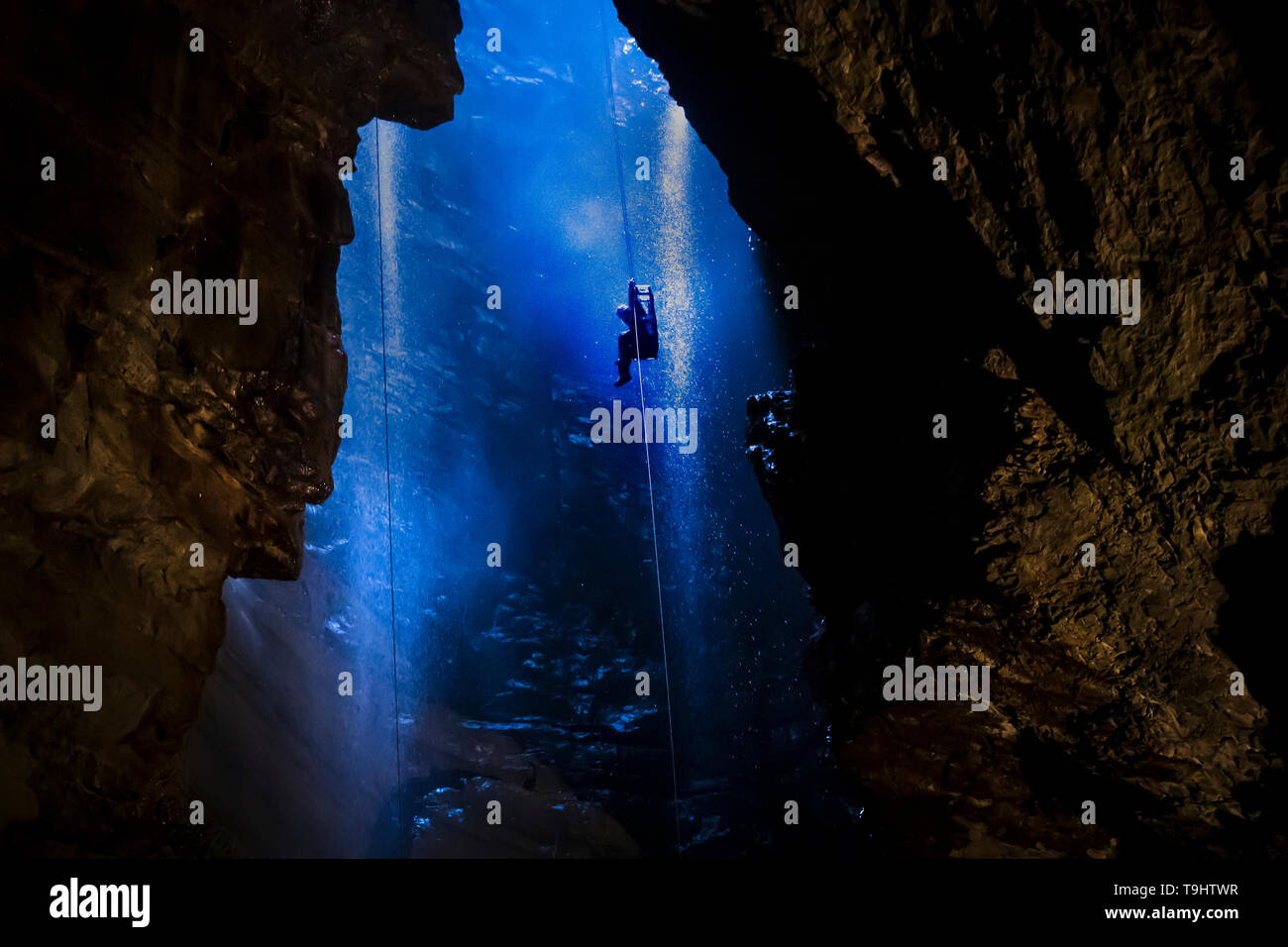 A potholer is winched into Gaping Gill, the largest cavern in Britain ...