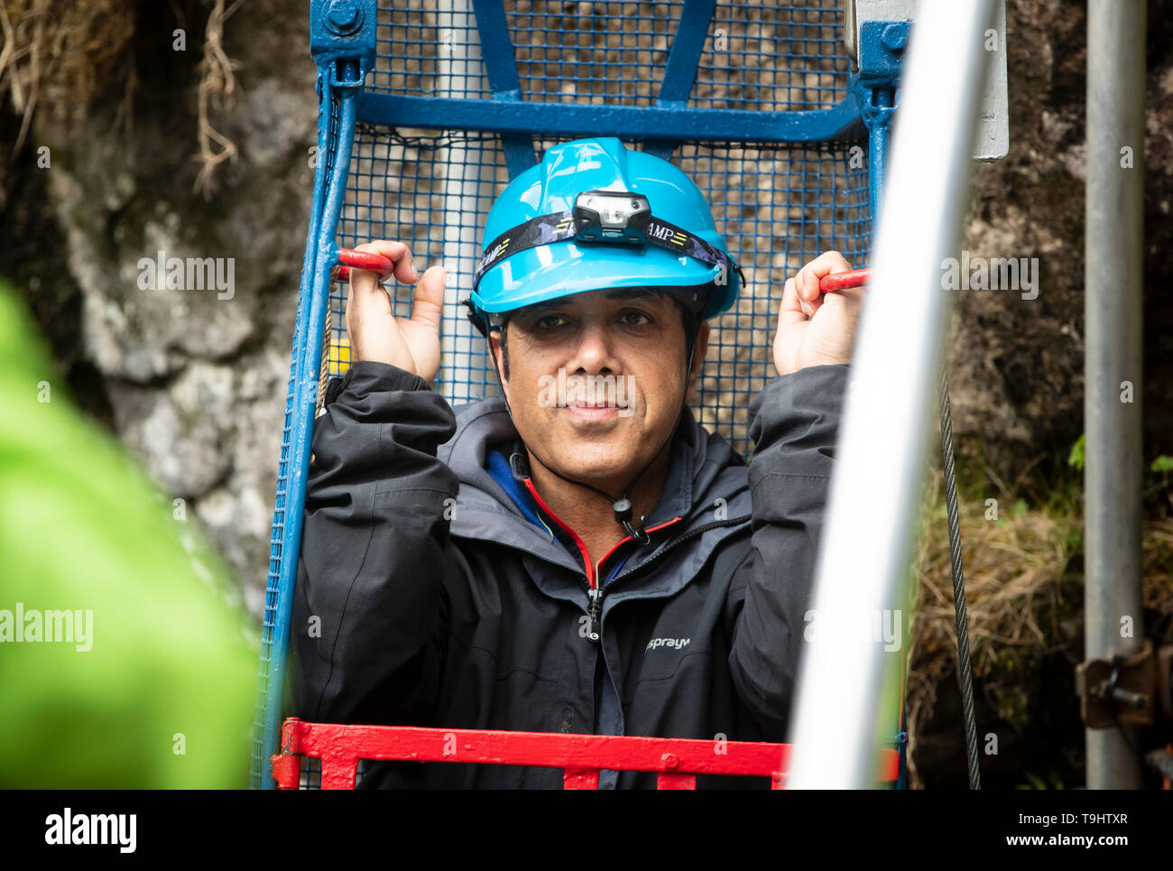 A potholer is winched into Gaping Gill, the largest cavern in Britain ...