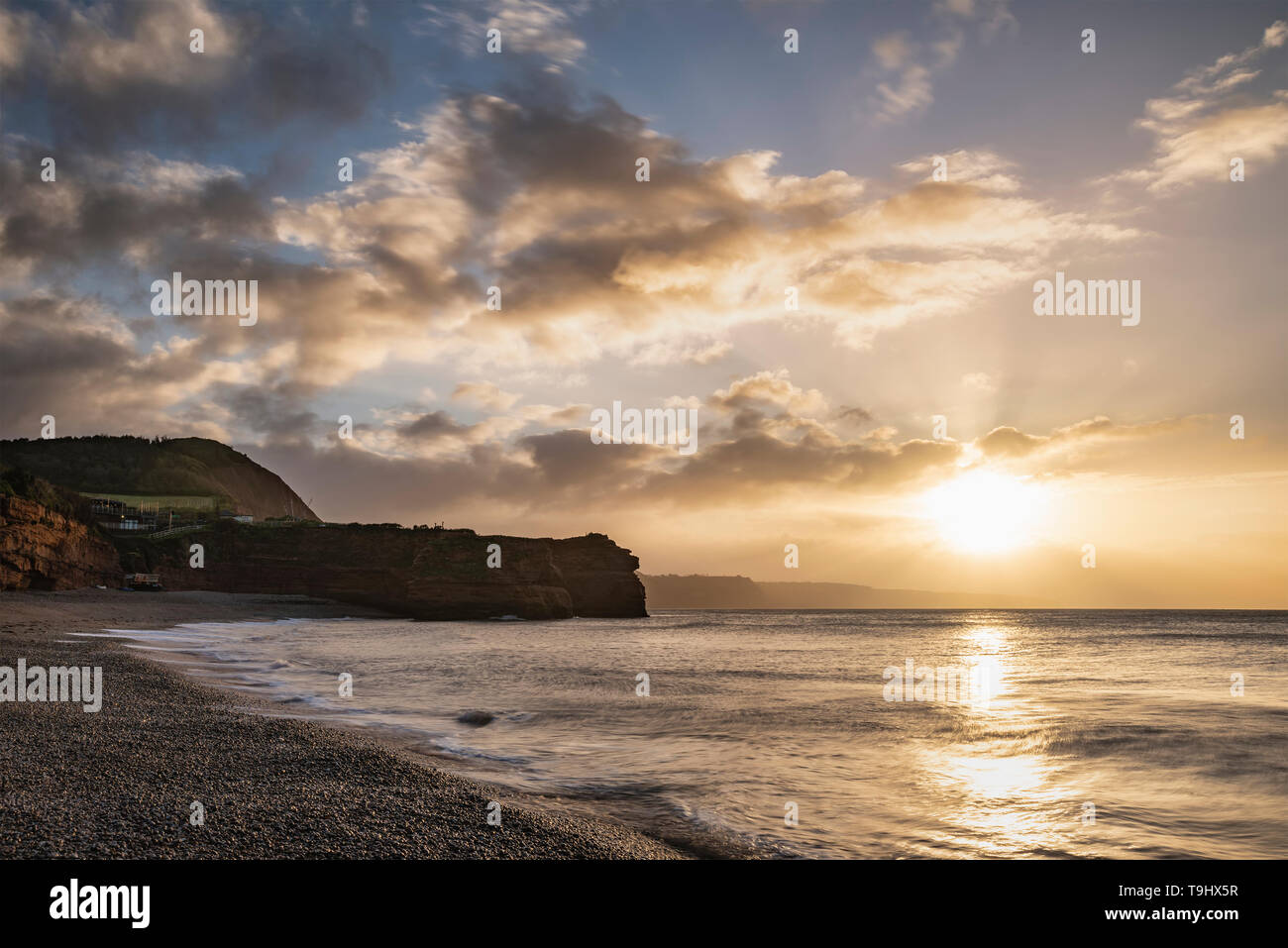 Beautiful sunrise landscape image of Ladram Bay beach in Devon England ...