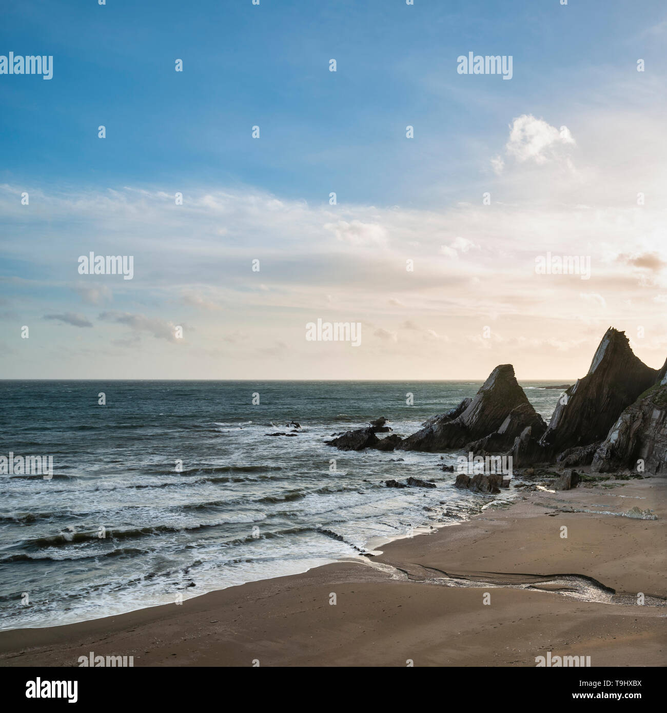 Beautiful sunset landscape image of Westcombe Beach in Devon England ...