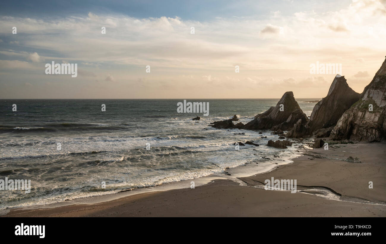 Beautiful sunset landscape image of Westcombe Beach in Devon England ...