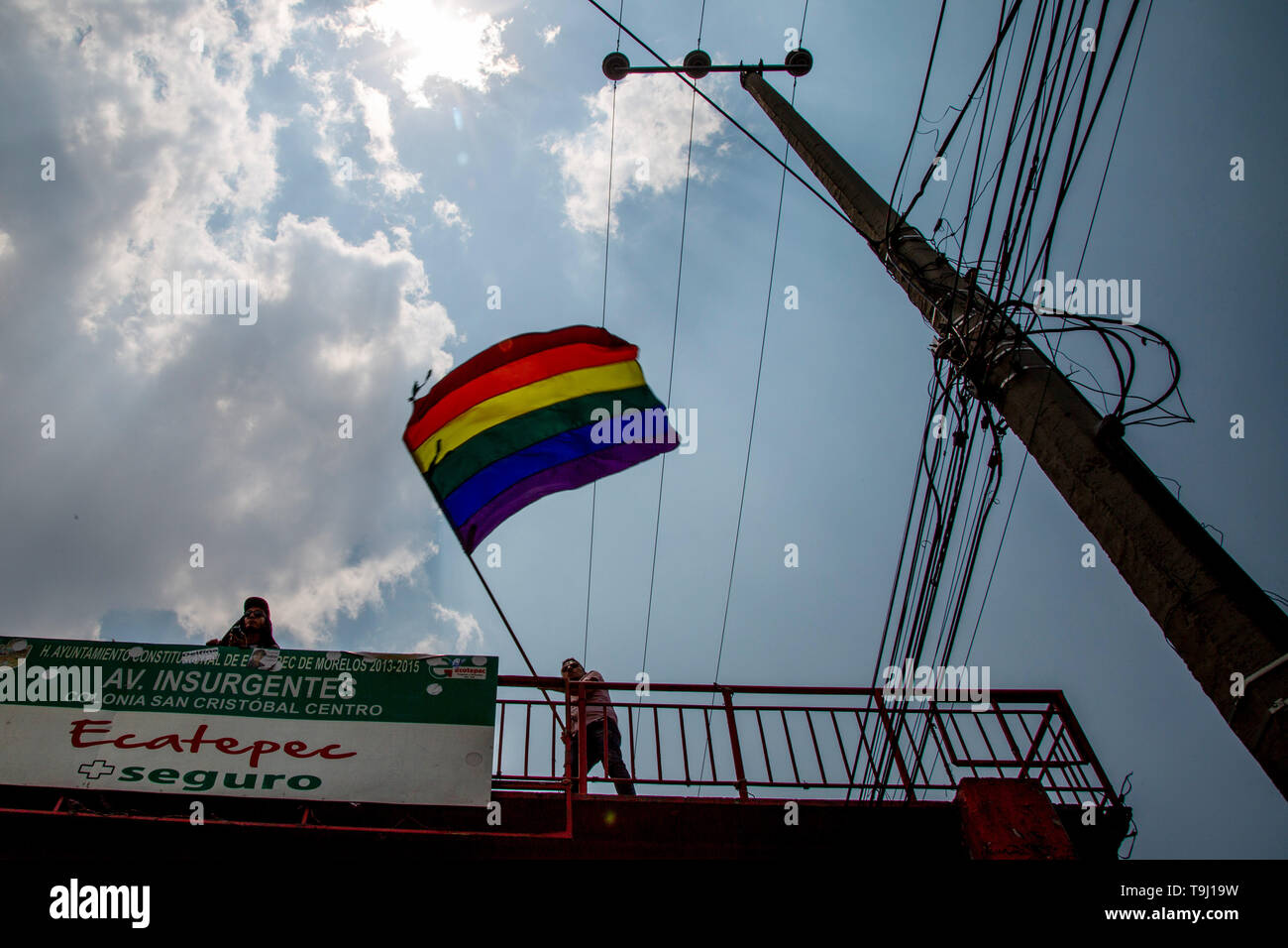 Ecatepec, Mexico. 18th May, 2019. A young man waving a rainbow flag at ...
