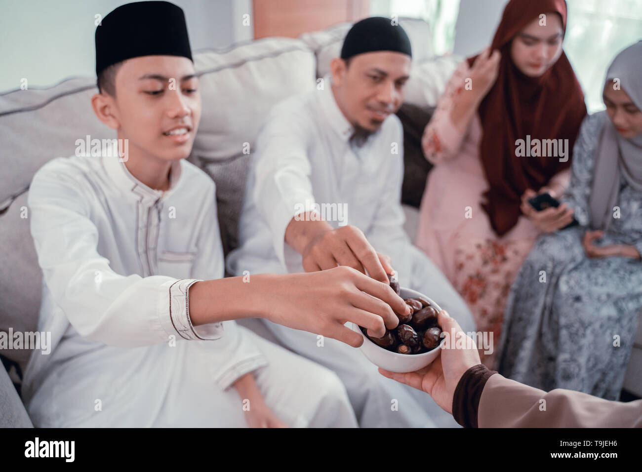 muslim people taking dates fruit for breaking fast at home Stock Photo ...