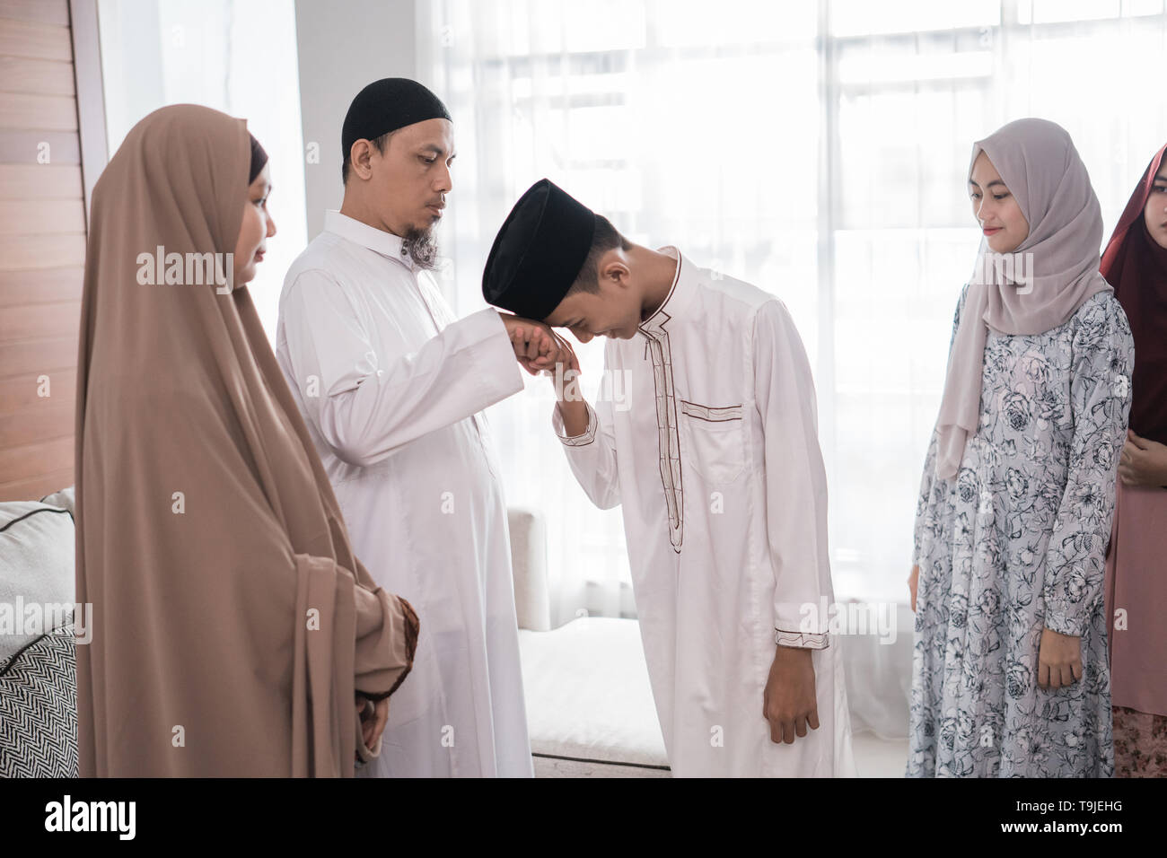 muslim family shake hand apologizing during the Eid mubarak ramadan ...