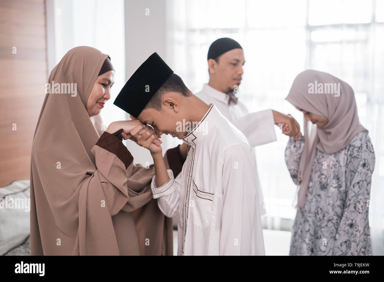 muslim family shake hand apologizing during the Eid mubarak ramadan ...