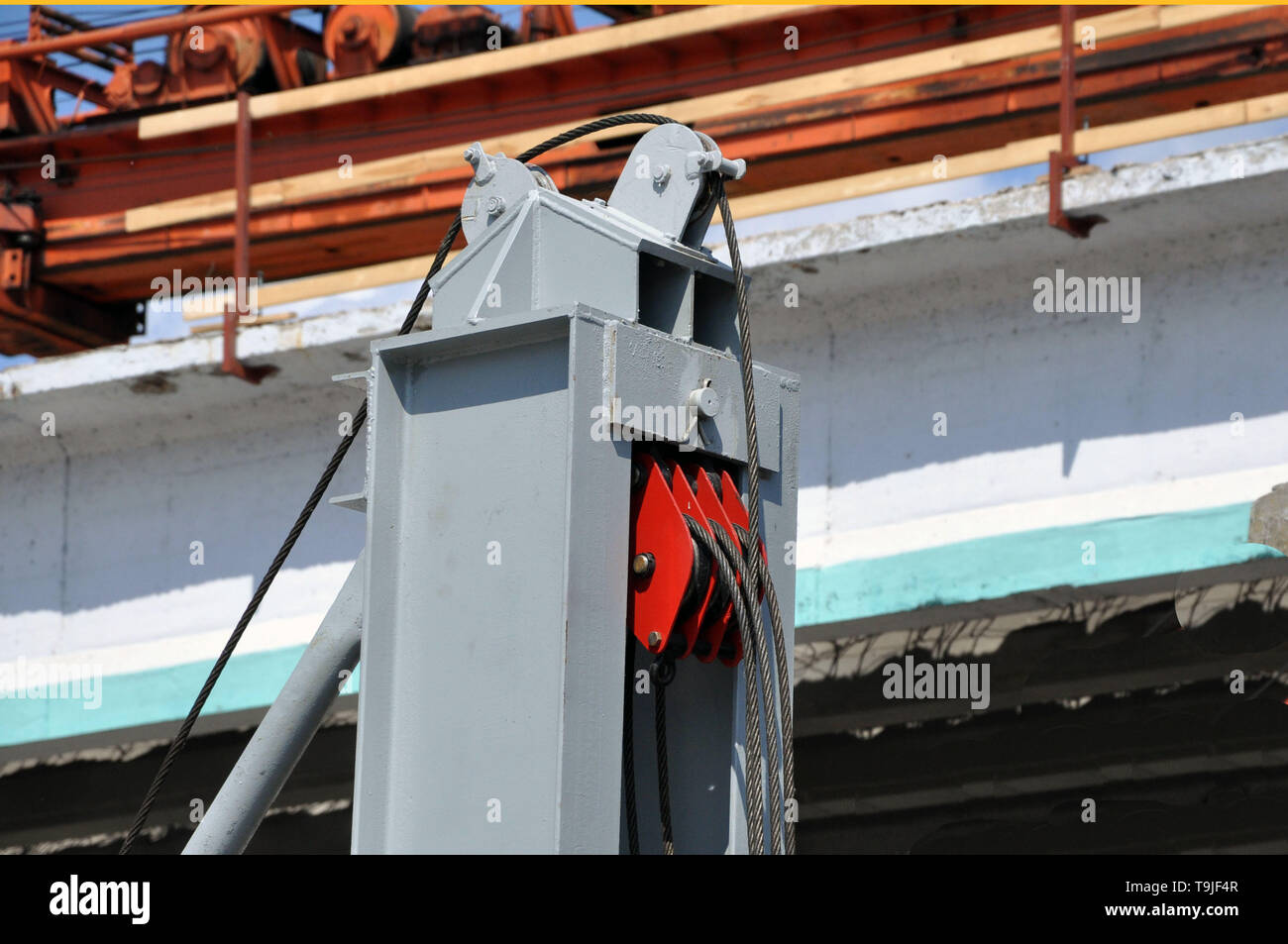 lifting block with cables on a bridge under construction Stock Photo ...