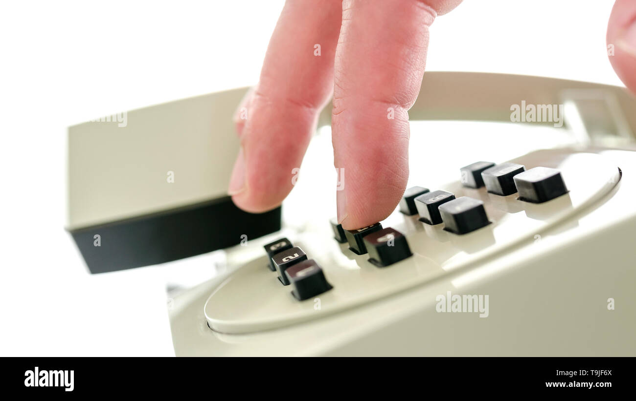 Side view of dialing a phone number on an outdated telephone Stock ...