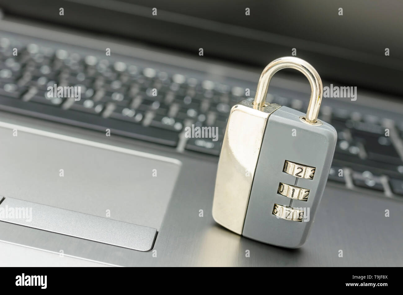 Padlock on laptop keyboard. Concept of online safety Stock Photo - Alamy