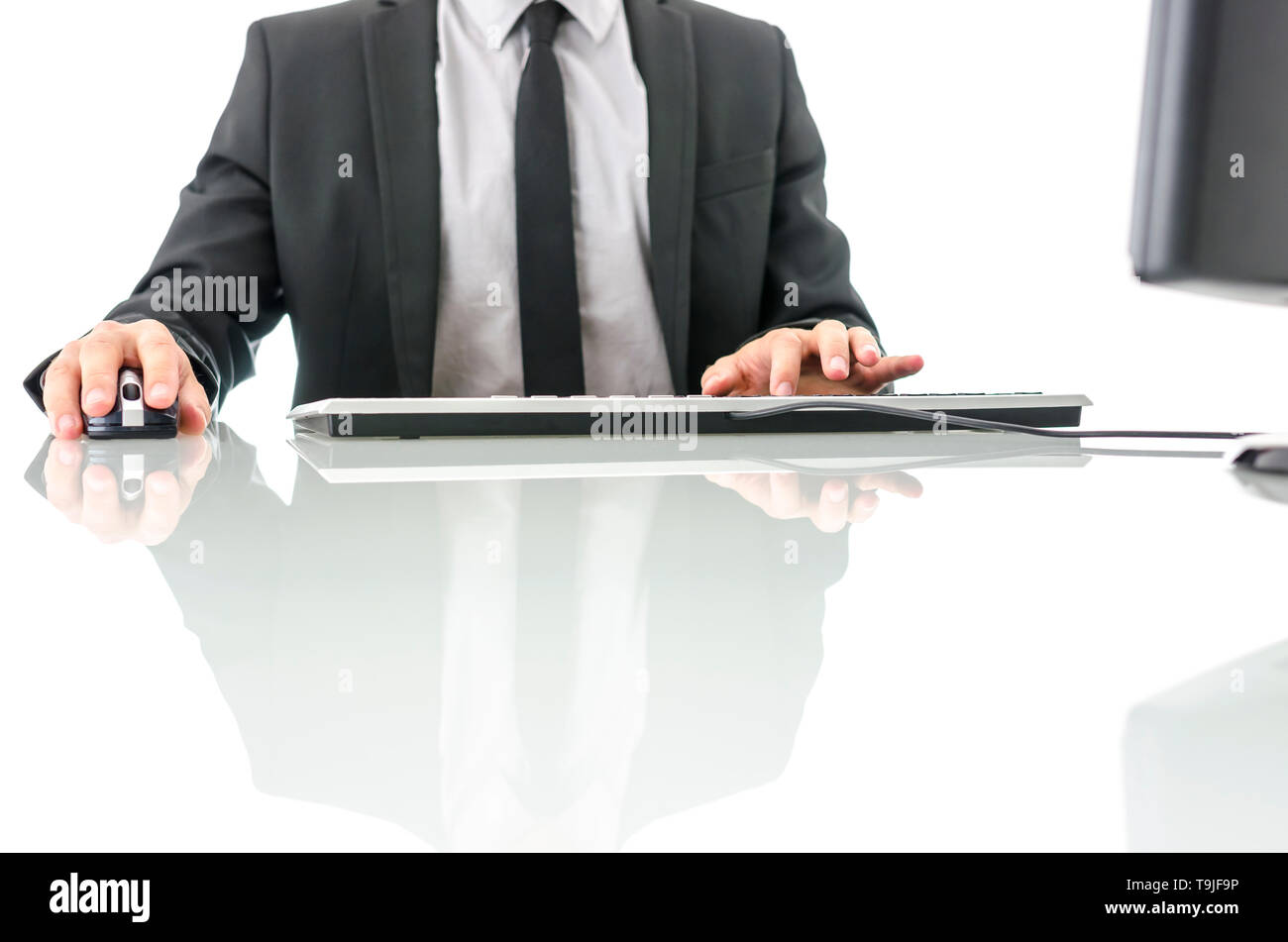 Office worker working on computer at his white desk Stock Photo - Alamy