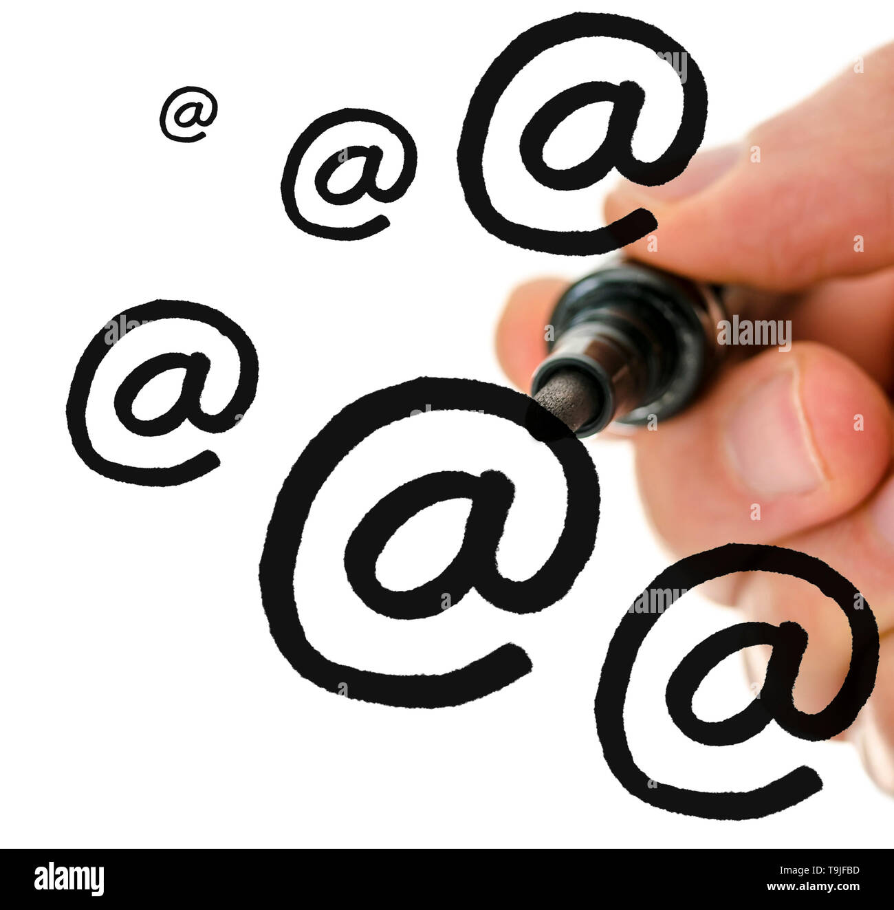 Close up of male hand writing multiple email symbols on a virtual white ...