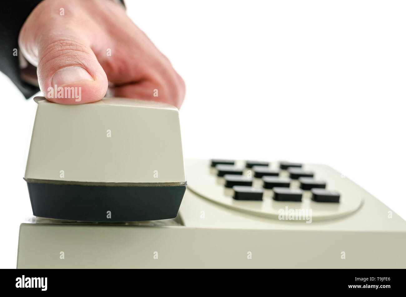 Closeup of businessman hand holding telephone receiver as if he is ...