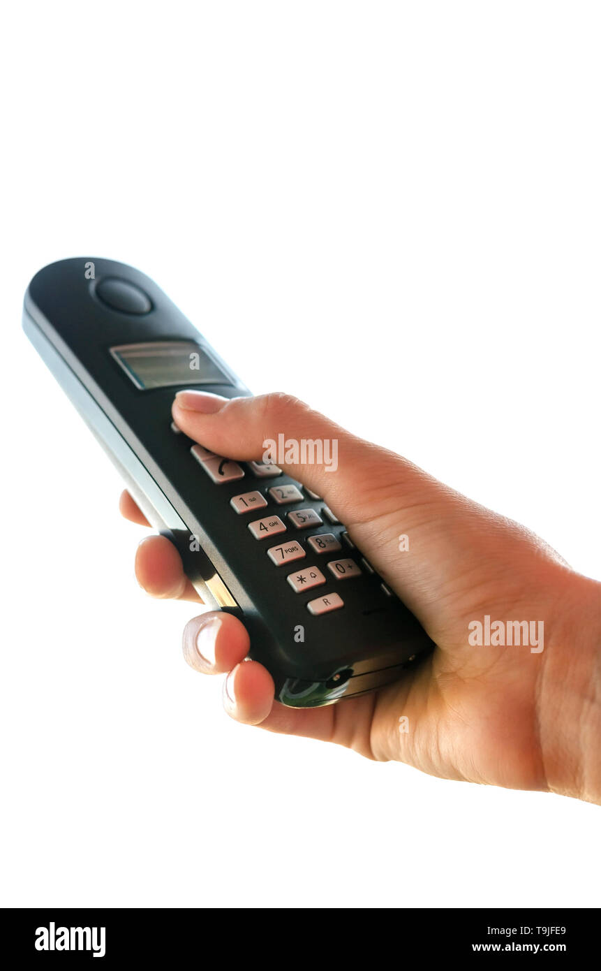 Female hand holding portable telephone handset. Isolated over white ...