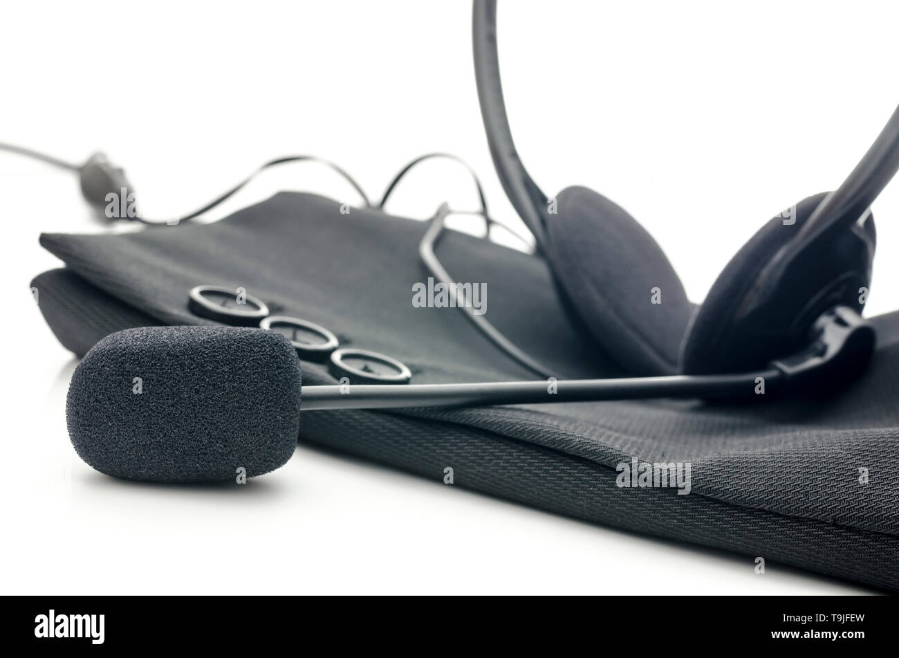 Detail of headset on elegant business suit sleeve Stock Photo - Alamy